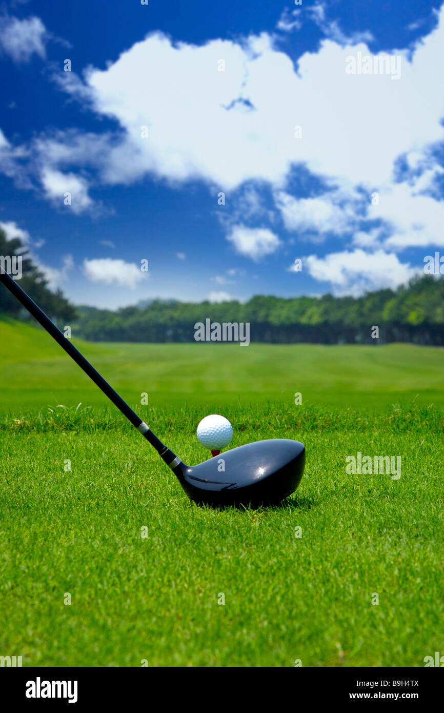 Golf club and golf ball ground view close up Stock Photo - Alamy