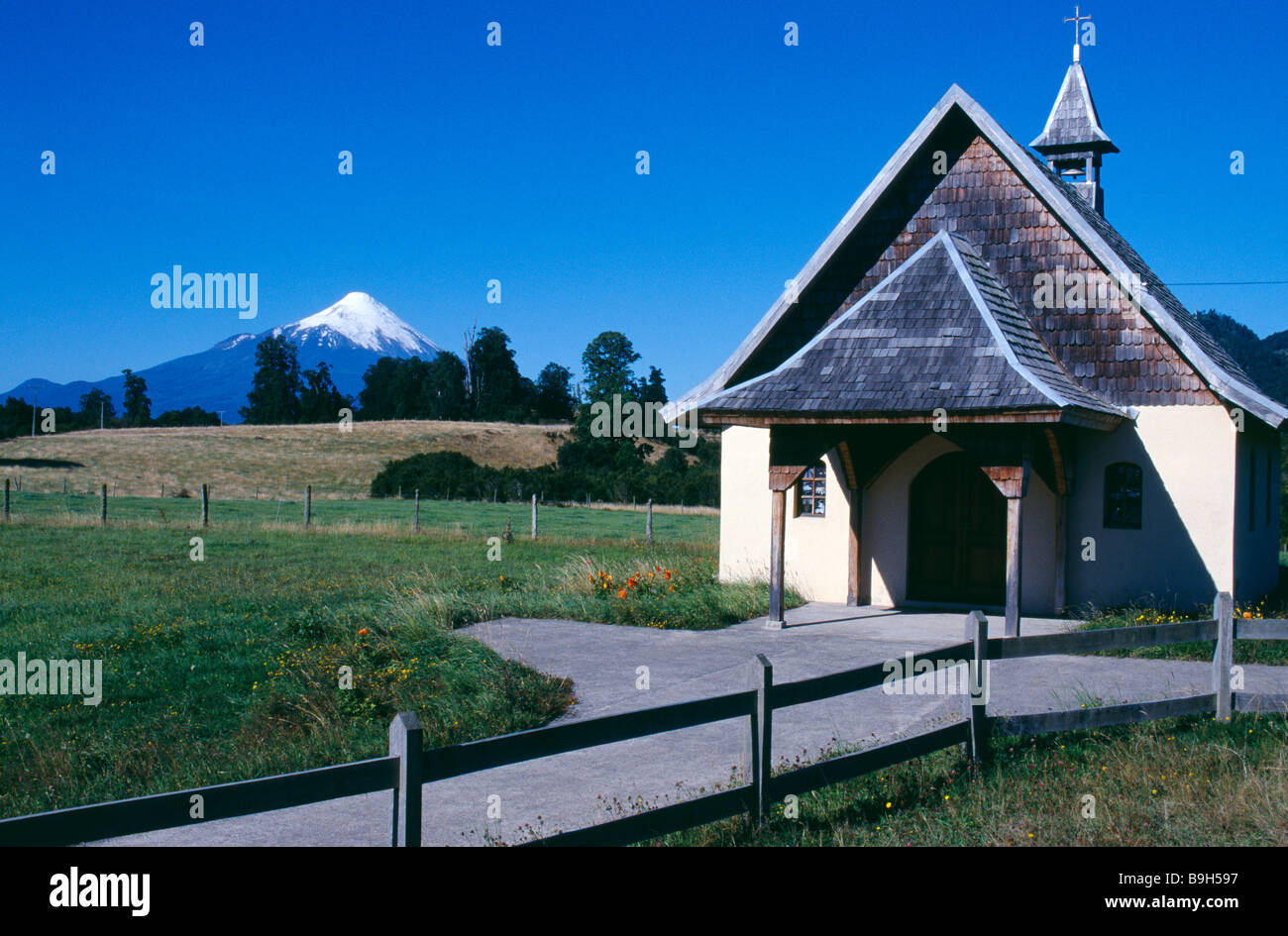 Chile, Lake District, Lago Llanquihue. Chapel with Volcan Osorno in the ...