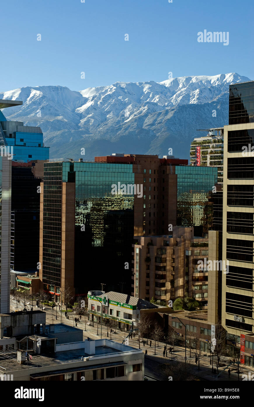 Chile, Santiago. The modern city centre with the Andes bathed in ...