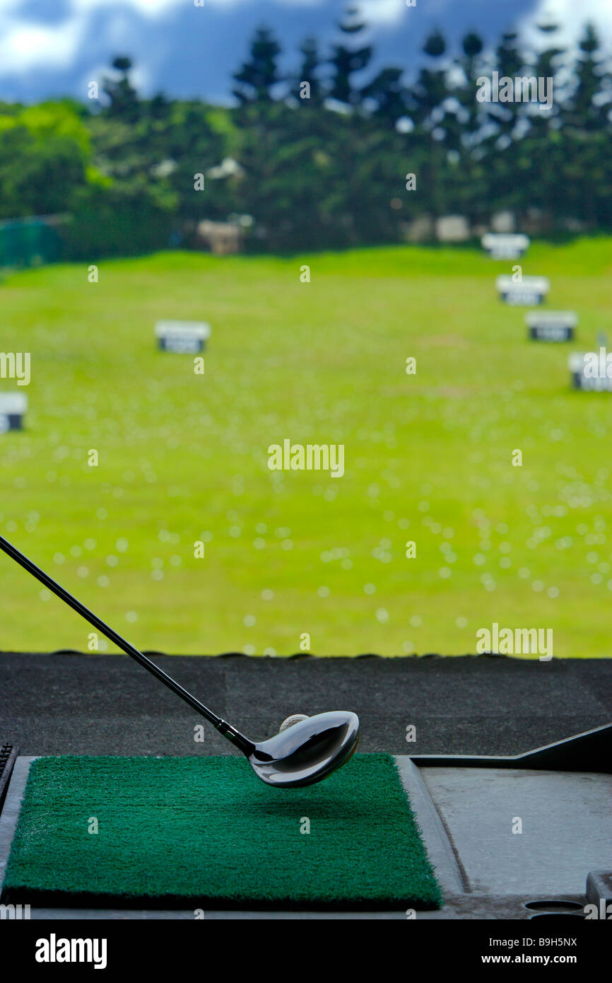 Club lined up with golf ball on driving range ground view Stock Photo ...