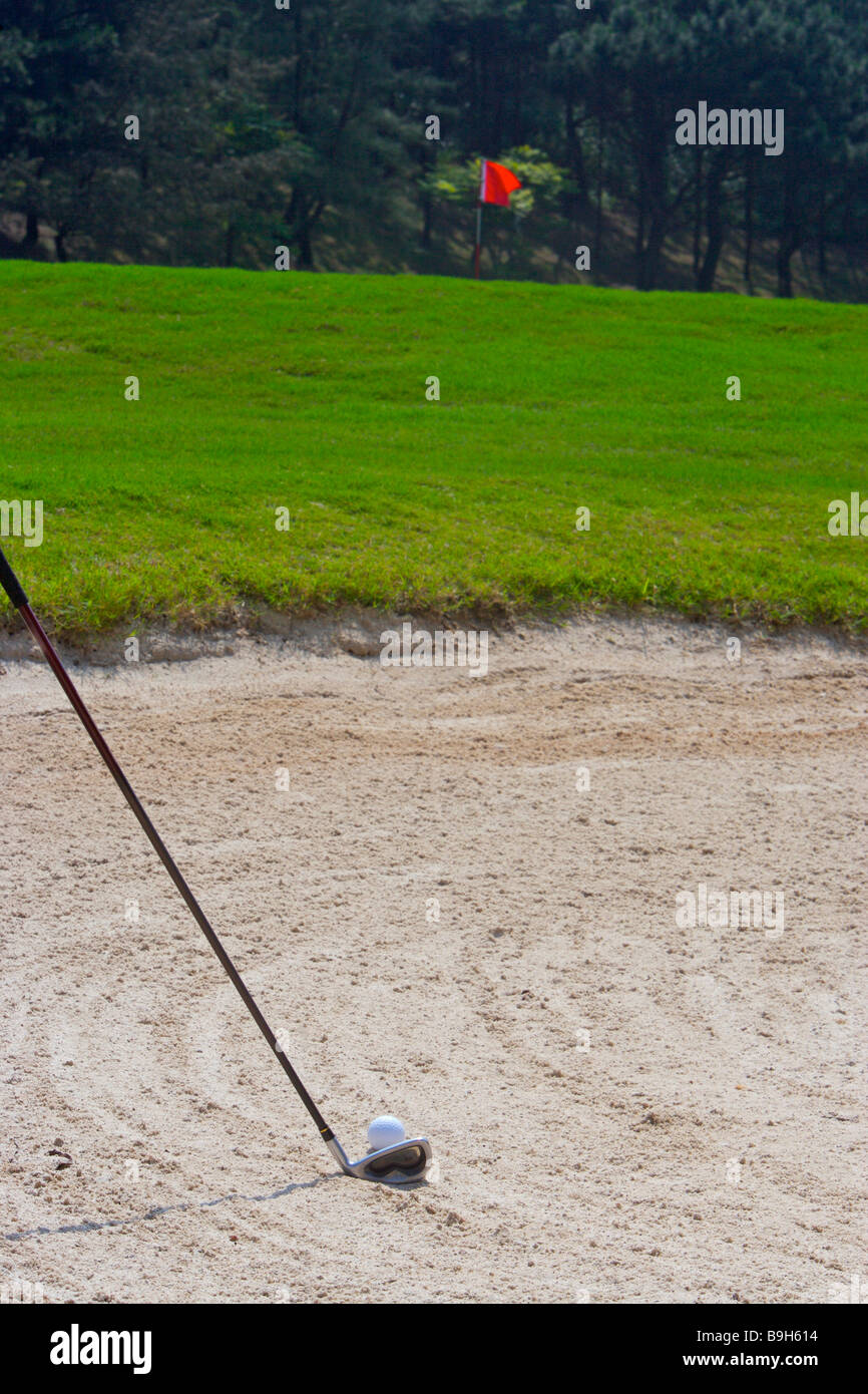 Close up of a golf club and a golf ball in sand trap Stock Photo - Alamy