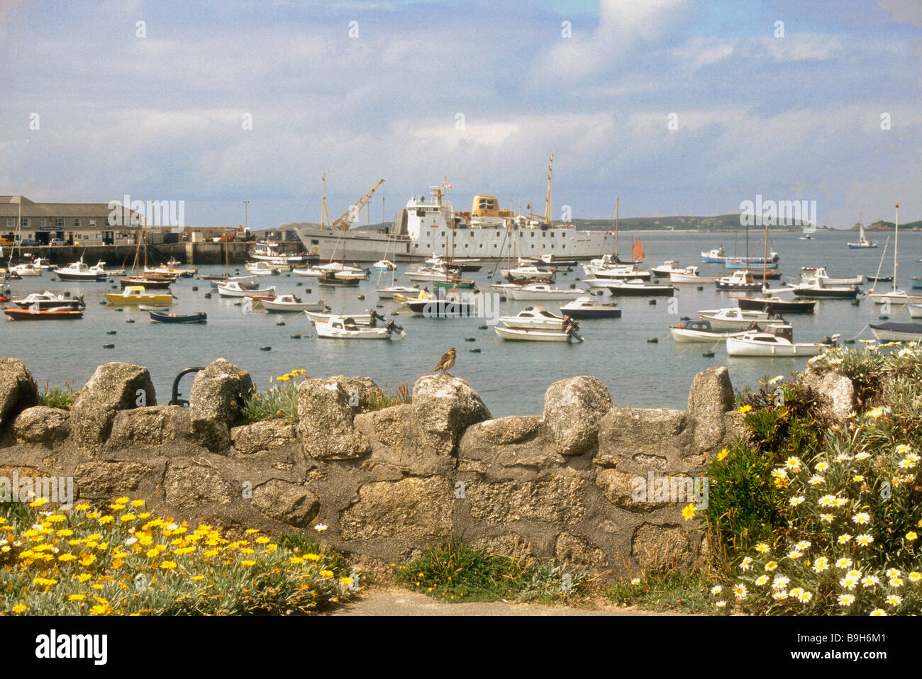 A view across Hugh Town Harbour with the passenger ship Scillonian III ...
