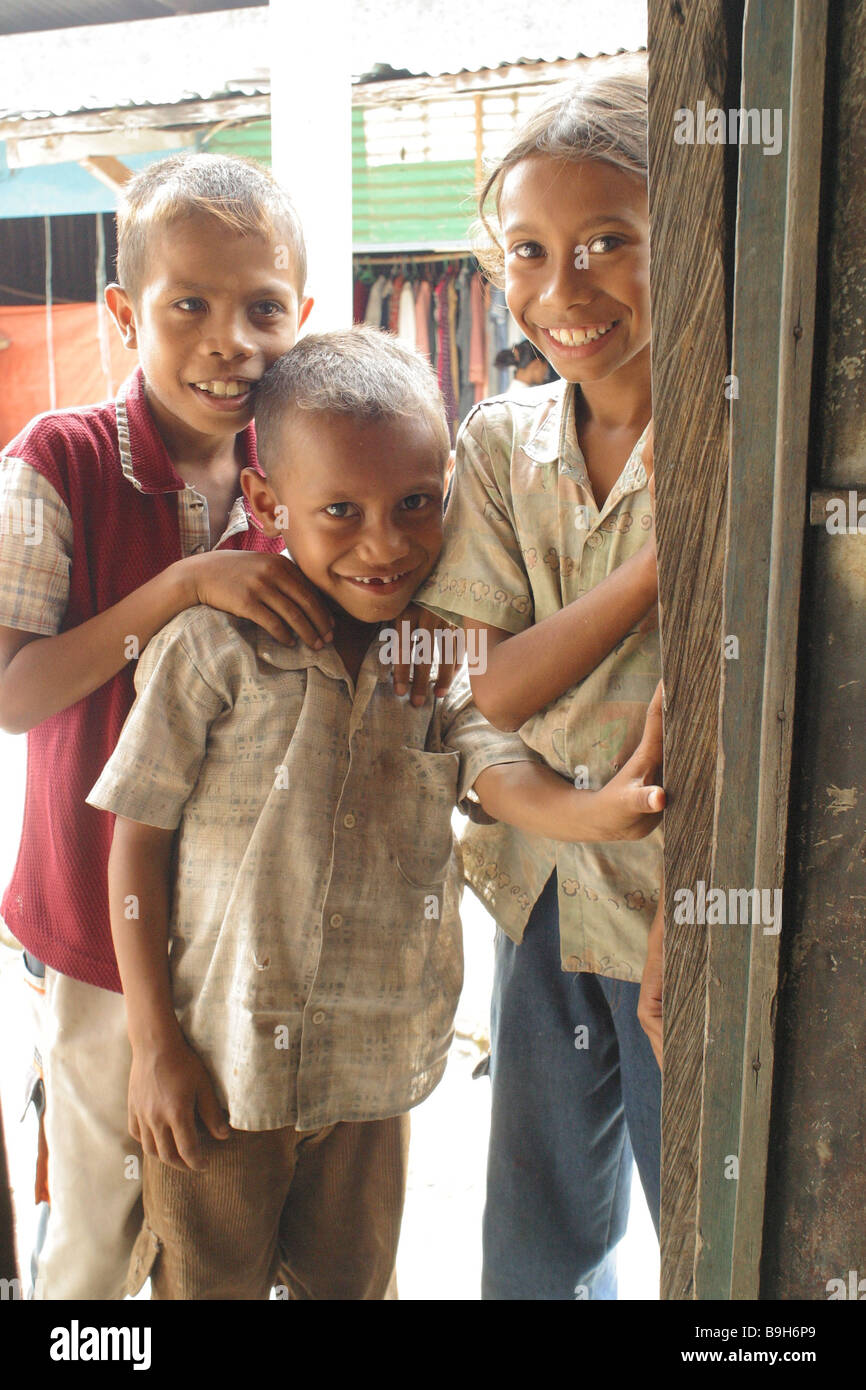 eastern-timor children three cheerfully smiling watching camera Asia ...