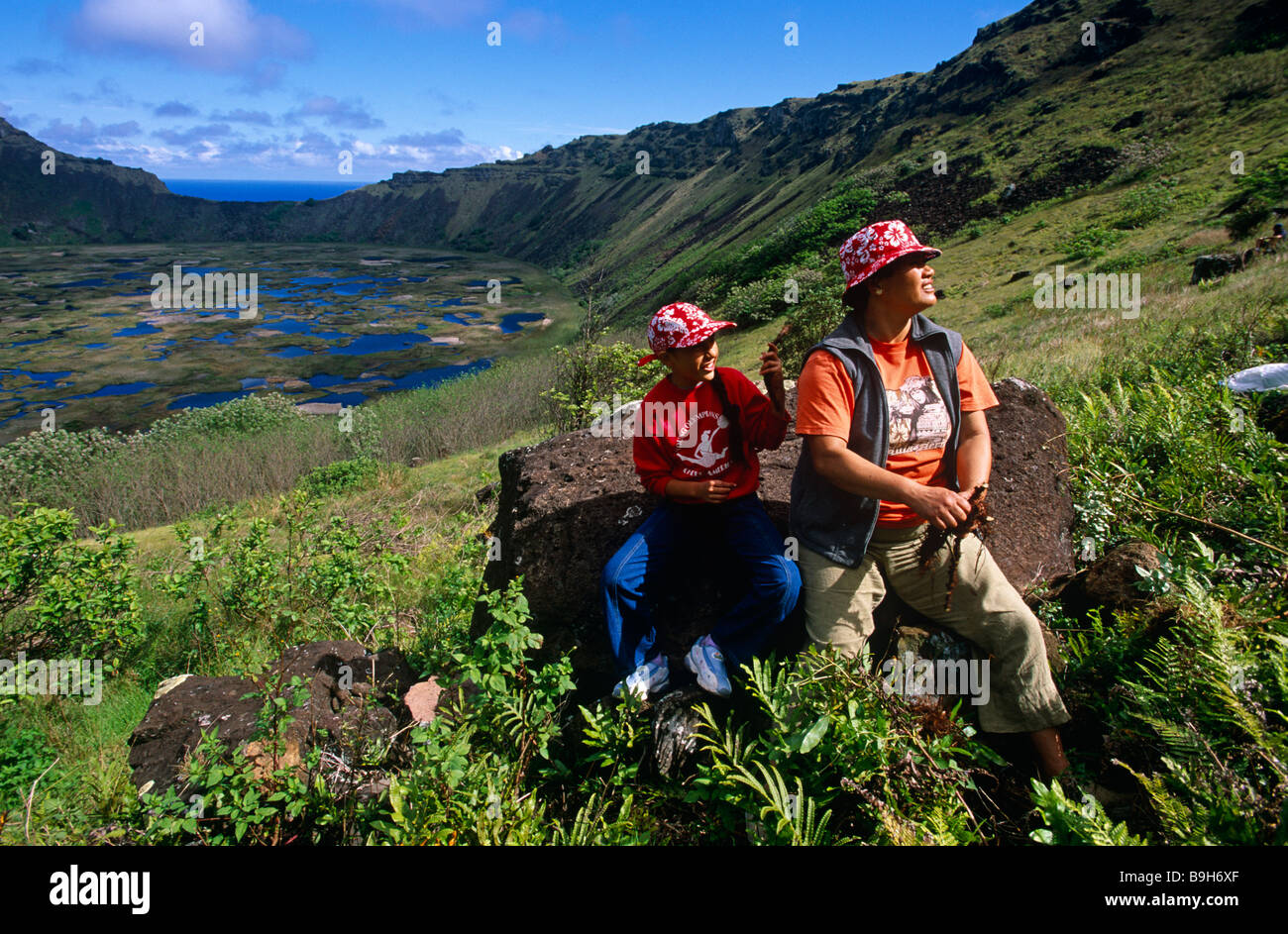 Chile, Easter Island. Native Islanders gathering medicinal plants in ...