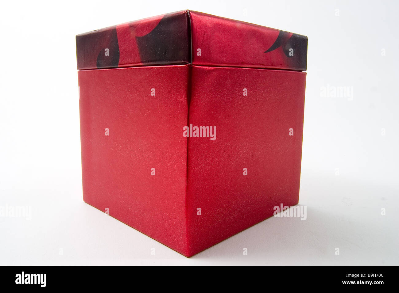 Package red still life studio Stock Photo - Alamy