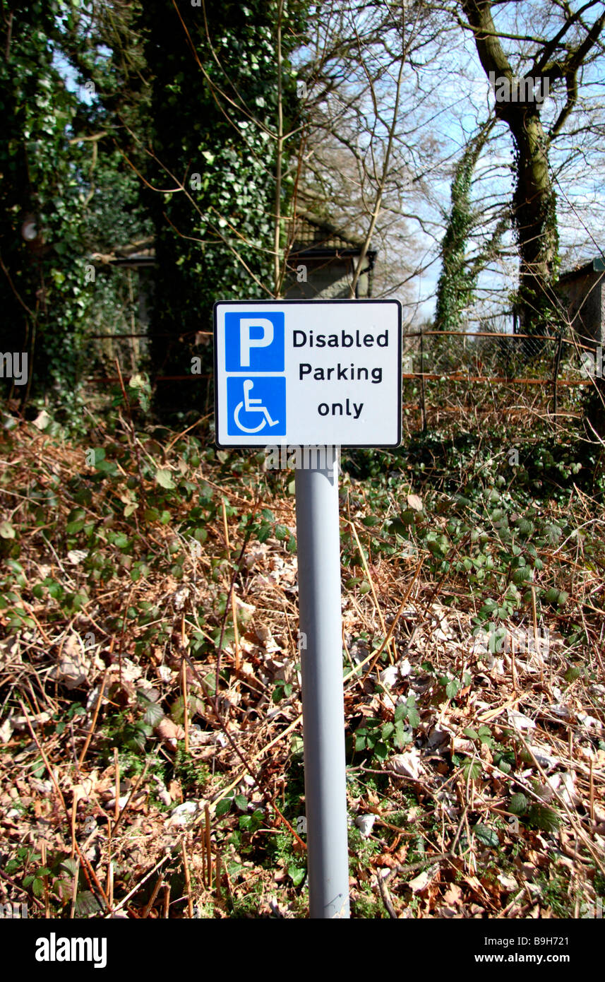 A sign above a special car parking space for disabled drivers in a ...