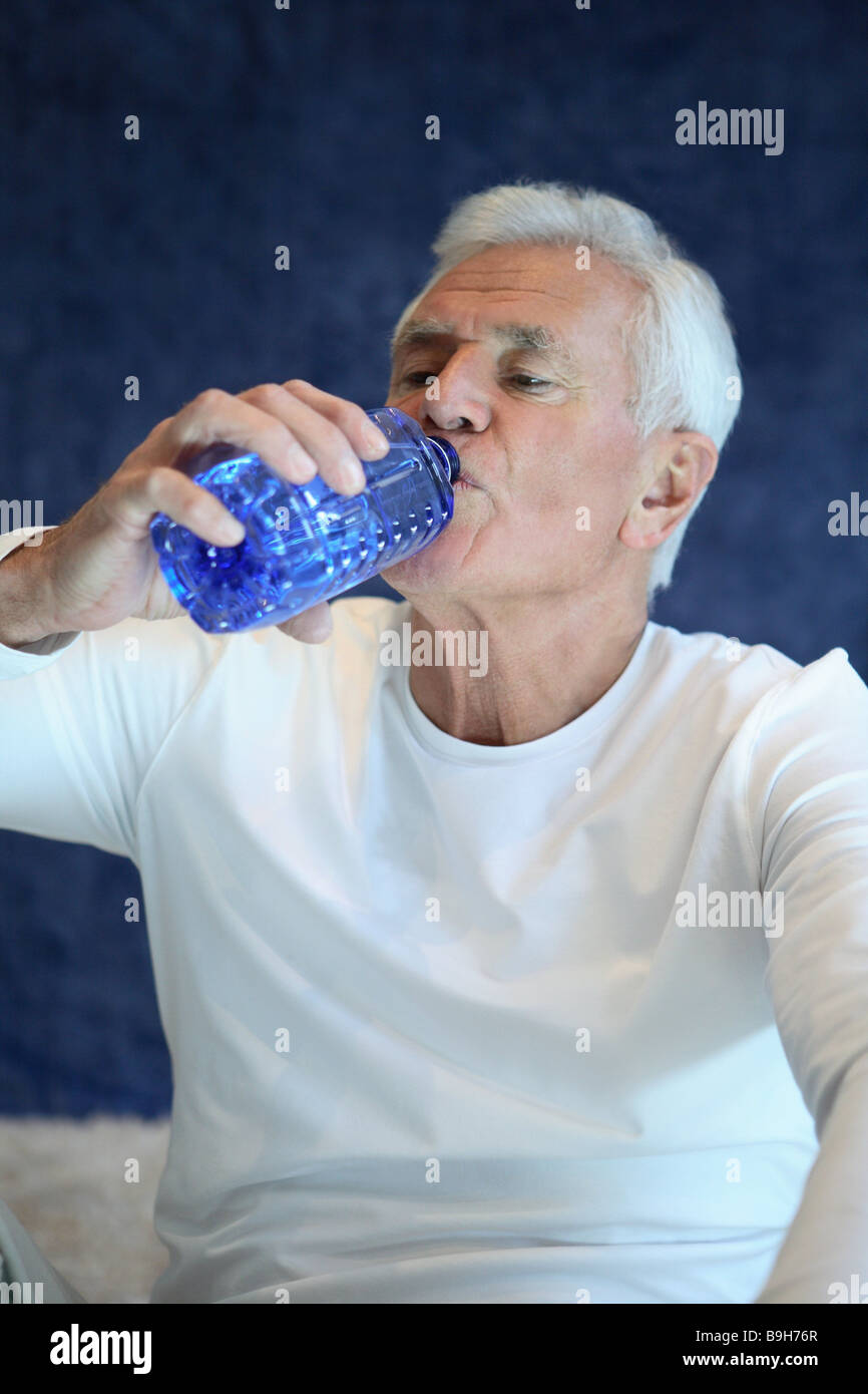 Sits senior floor water drinks semi-portrait series people seniors man ...