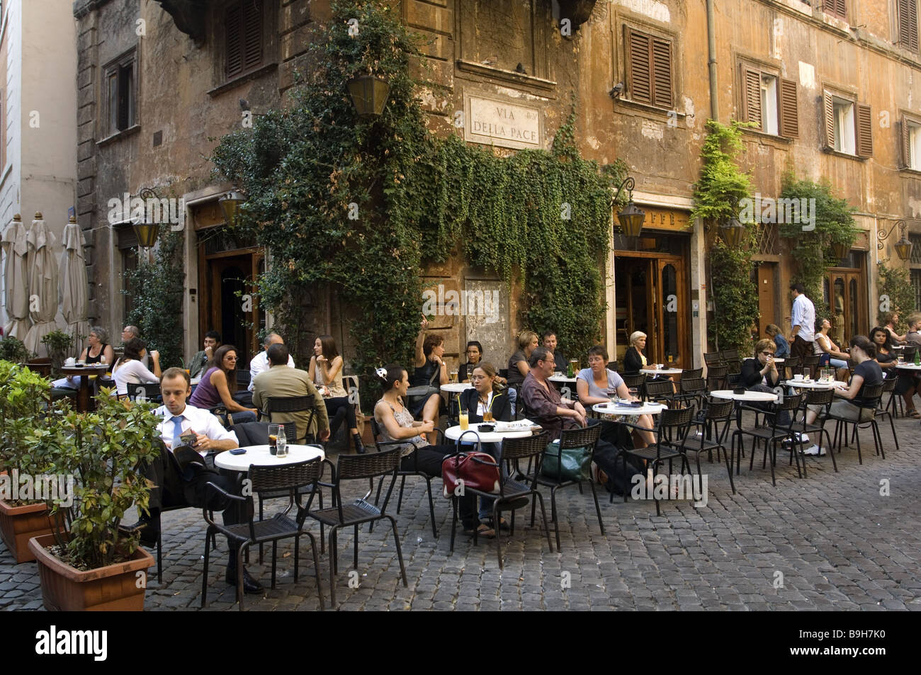 Italy Rome via della Pace cafe guests Stock Photo - Alamy