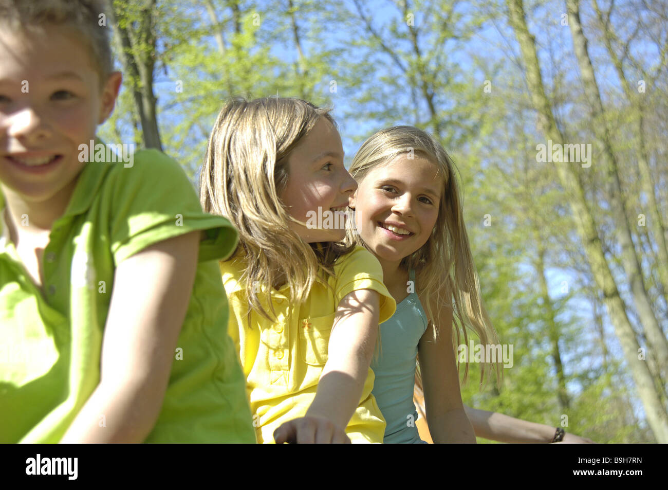 Children cheerfully laugh outside Stock Photo - Alamy