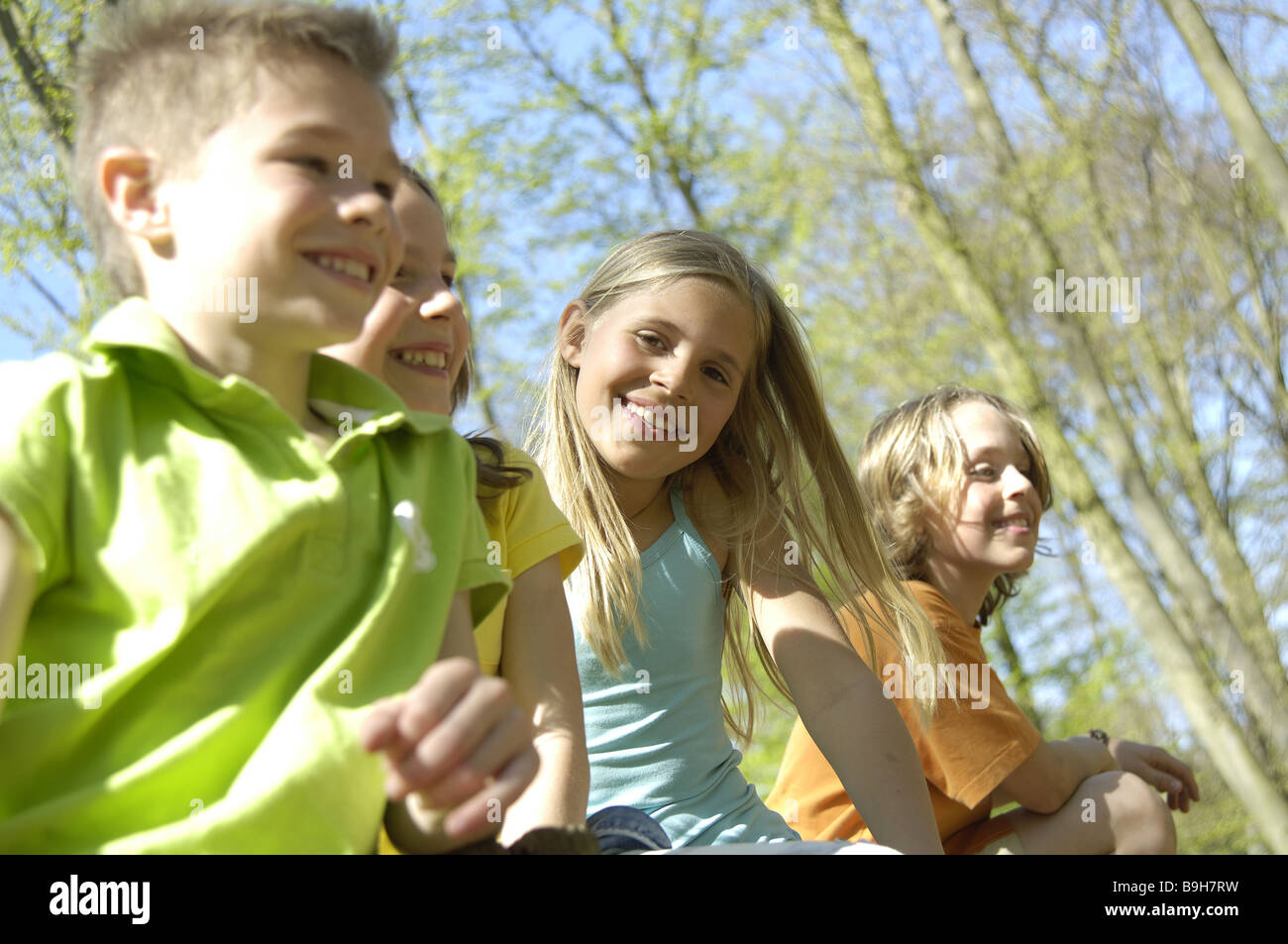 Children cheerfully laugh outside Stock Photo - Alamy