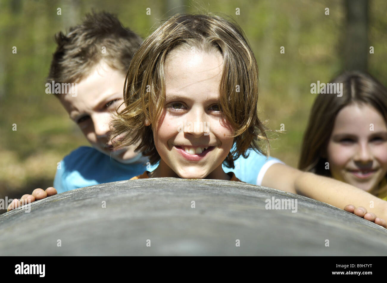 Children cheerfully laugh outside Stock Photo - Alamy