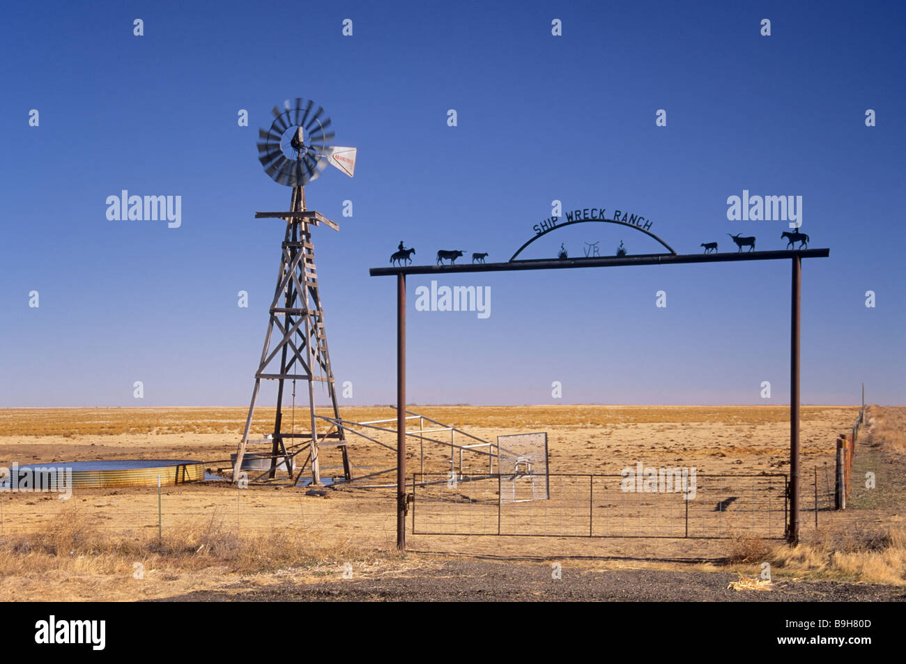 Ranch gate wrought iron sign and Aermotor wind pump at US 287 385 road ...