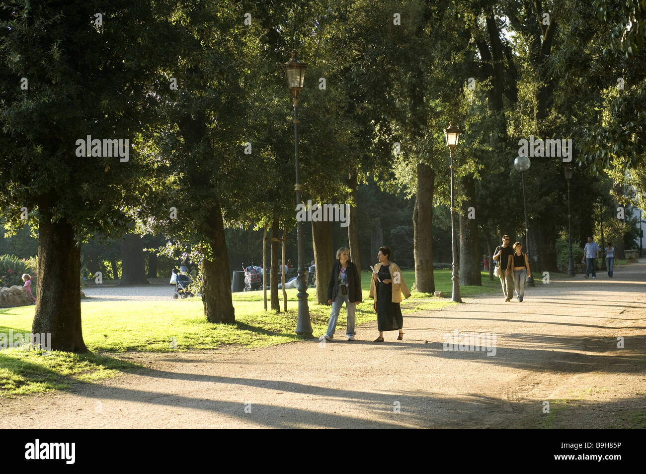 Italy Rome villa Borghese park persons out for a walk outside trees ...