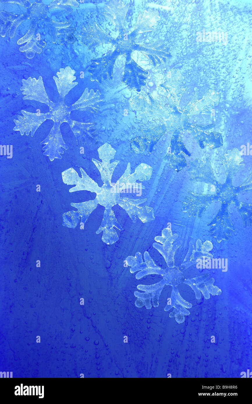 Surface blue ice-crystal back light water-drops windows slice snow ...