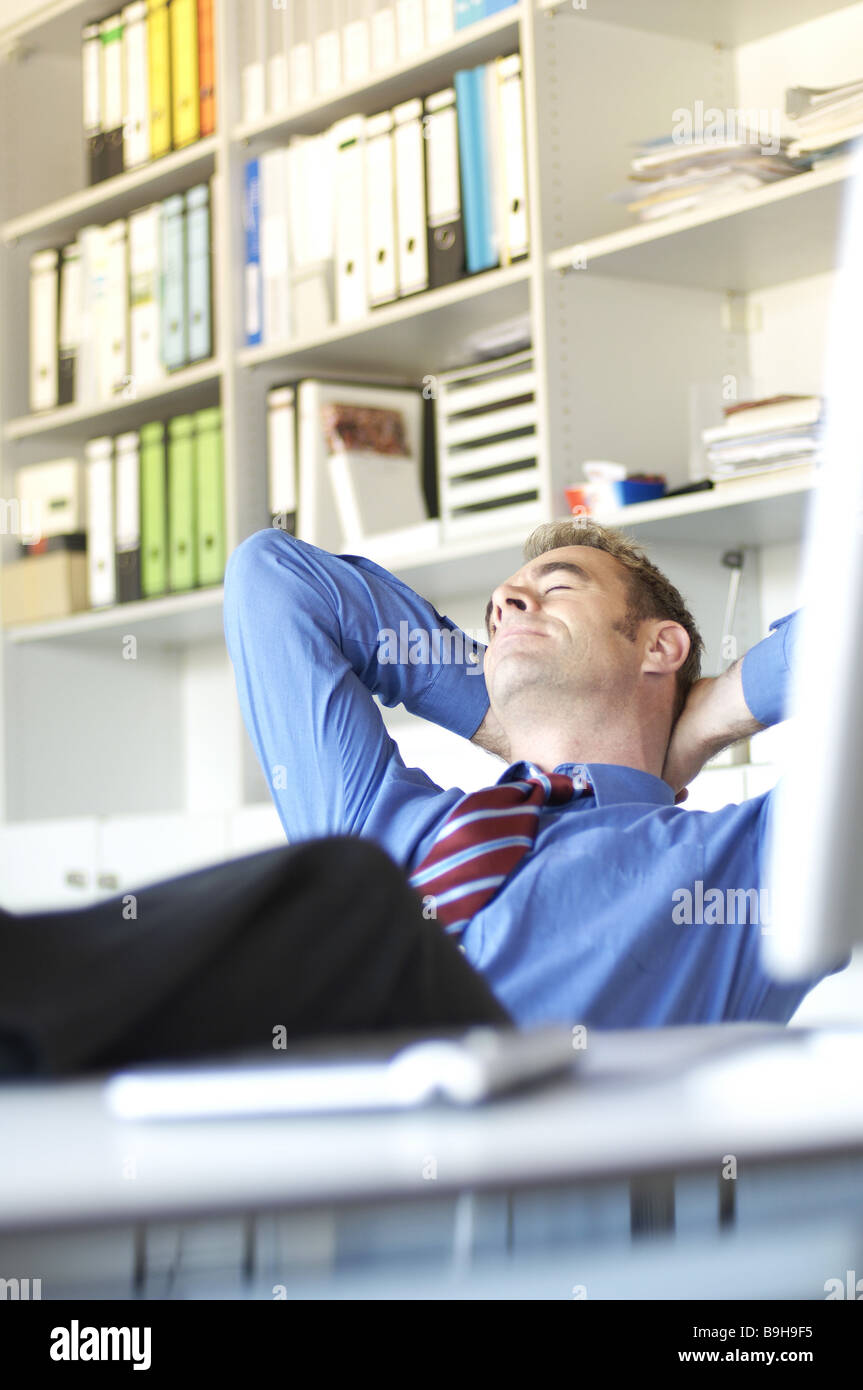 Office employee desk leans back relax detail series people man office ...