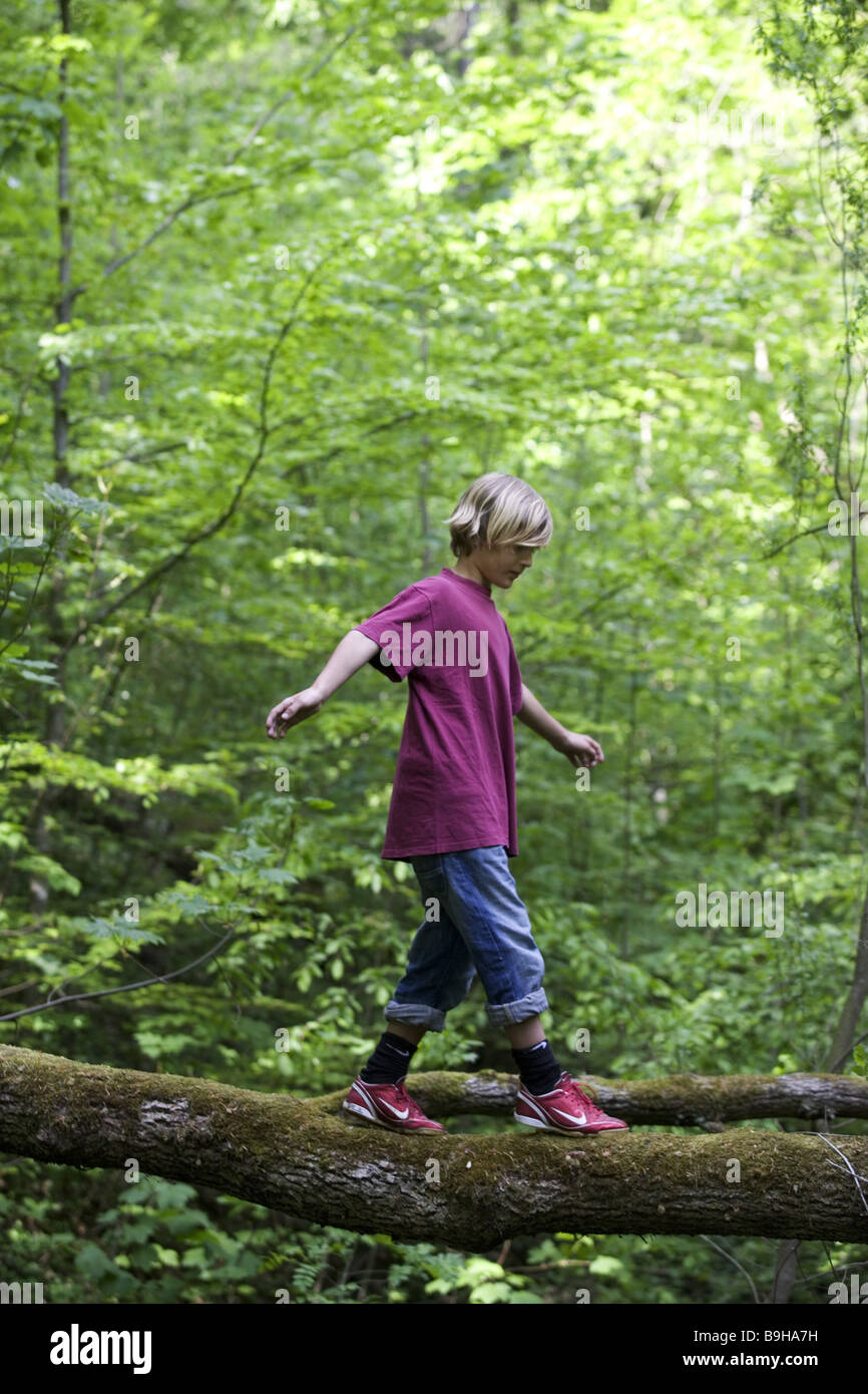 boy forest log balances Stock Photo - Alamy
