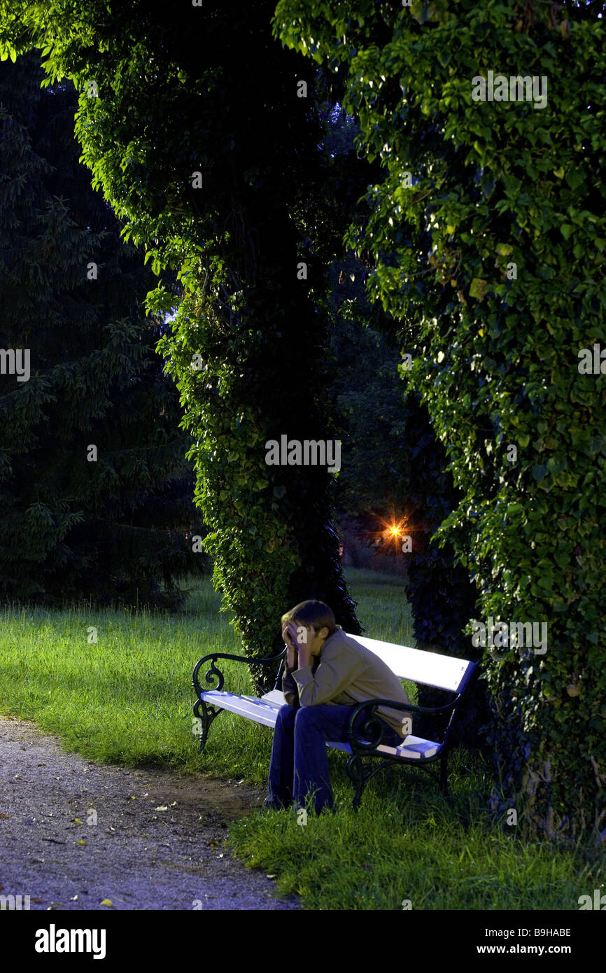 Boy sitting alone resting head hi-res stock photography and images - Alamy