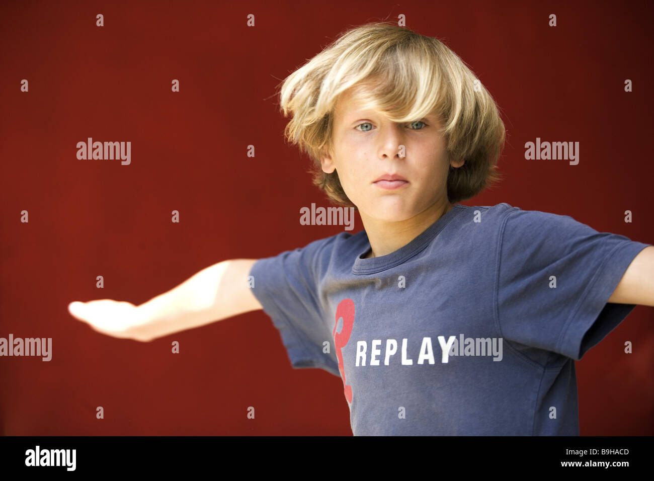 boy blond arm gesture stretched out movement portrait 12 years activity ...