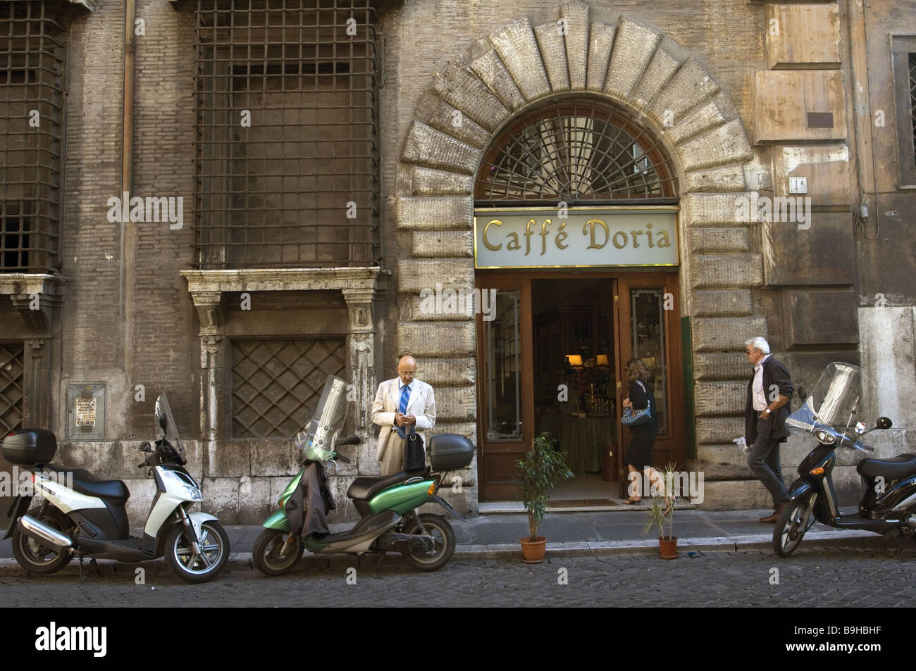 Rome cafe scooters hi-res stock photography and images - Alamy