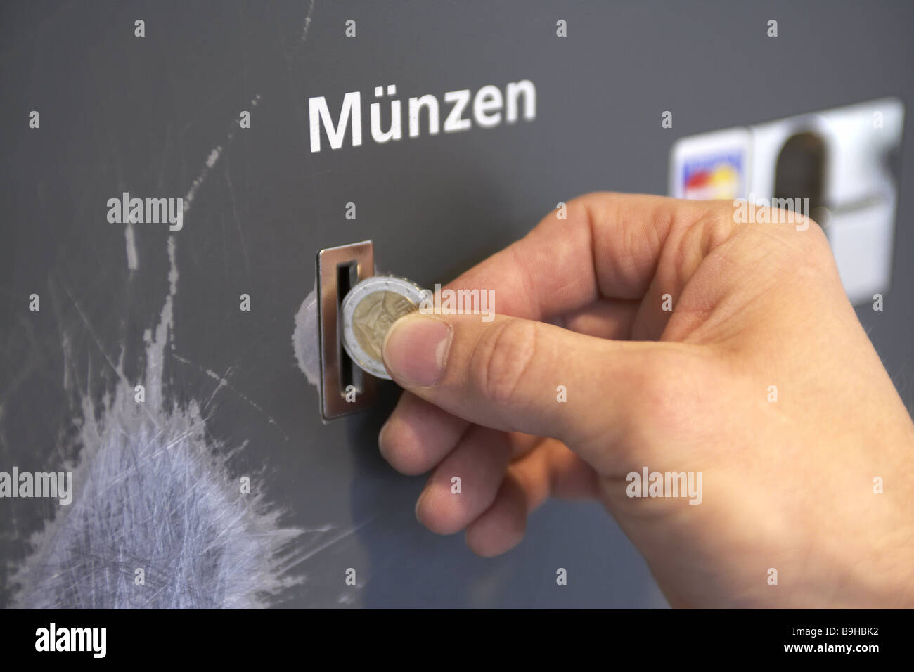 parking ticket machine coin hand interjects vending machine man's-hand ...