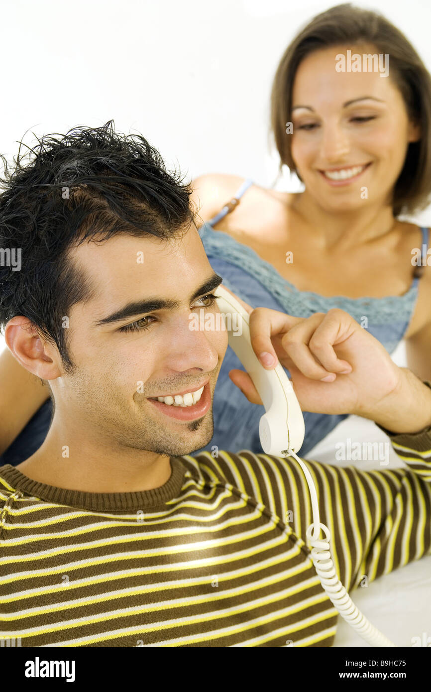 Mate young man telephones woman laughing sitting background 20-30 years ...