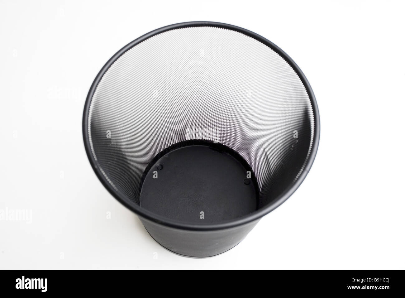 Waste paper basket empty studio Stock Photo - Alamy