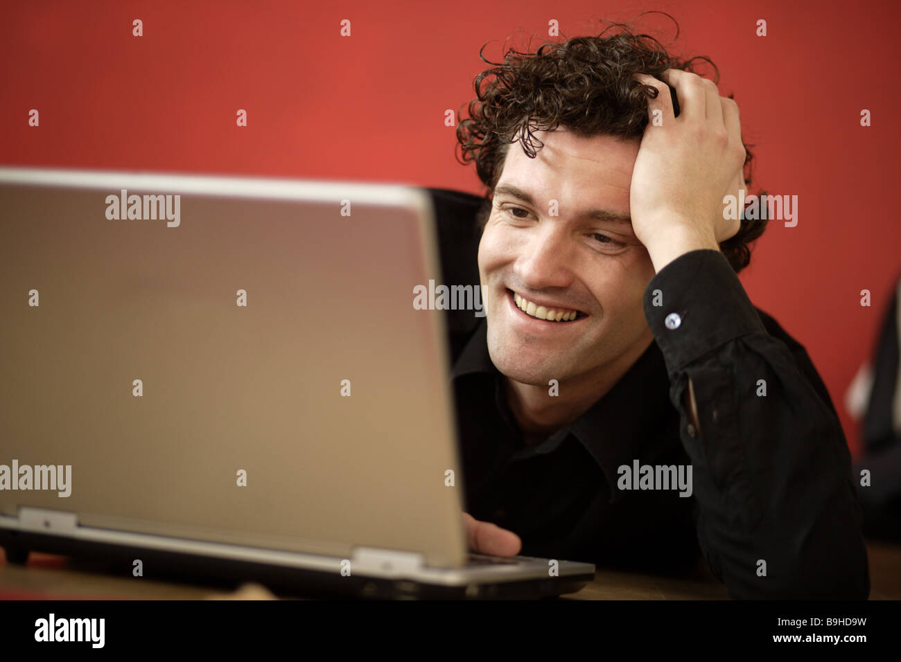 Man smiling Notebook data input portrait Stock Photo - Alamy