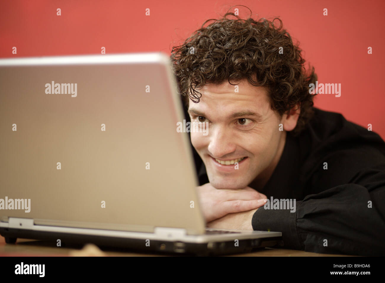 Man smiling Notebook data input portrait Stock Photo - Alamy