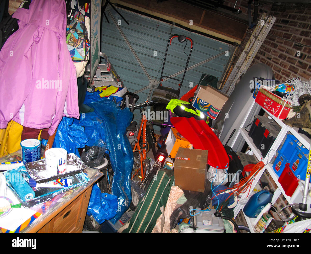 Messy domestic garage full of rubbish Stock Photo - Alamy