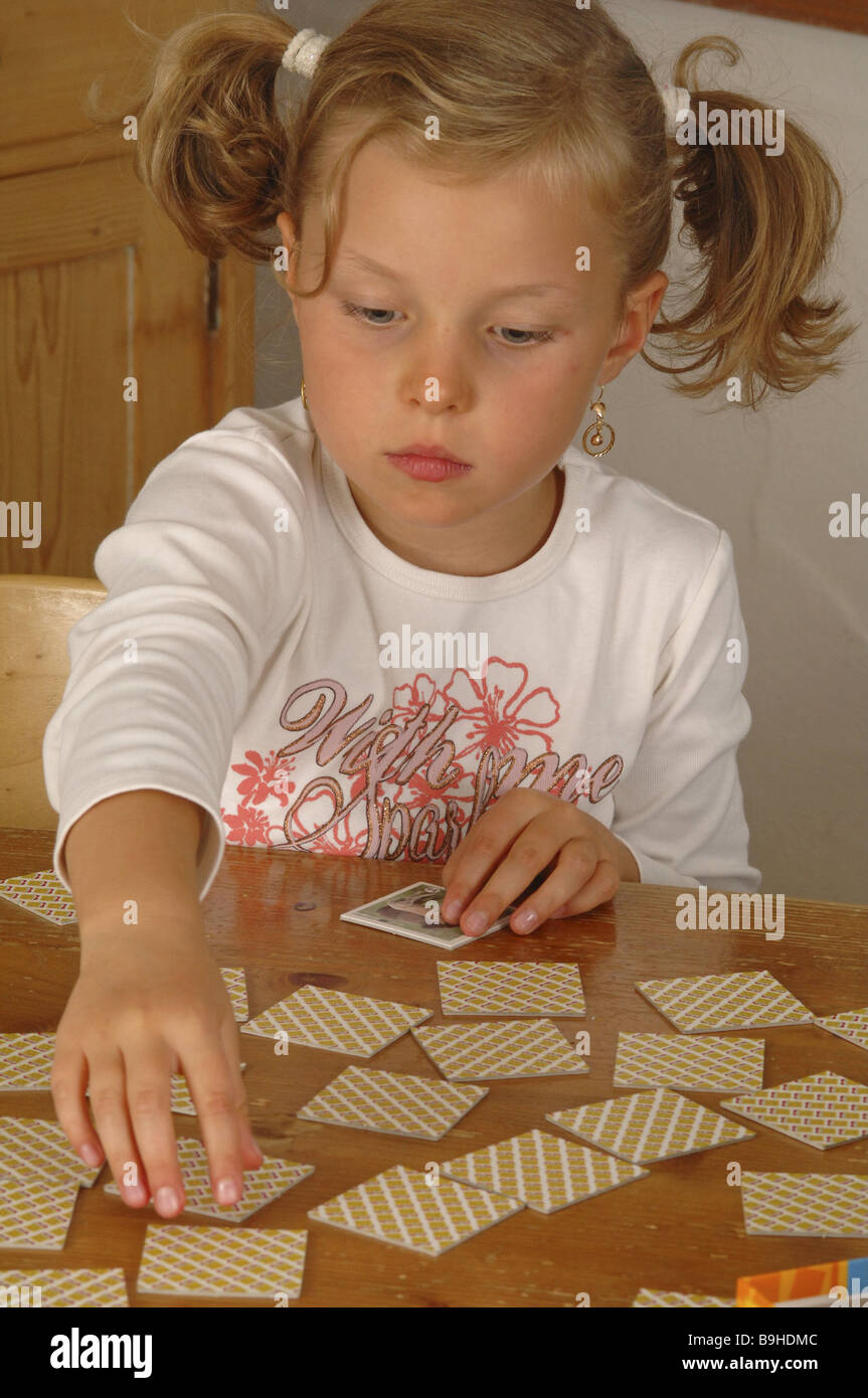 girl concentrates memory plays portrait people child childhood blond ...
