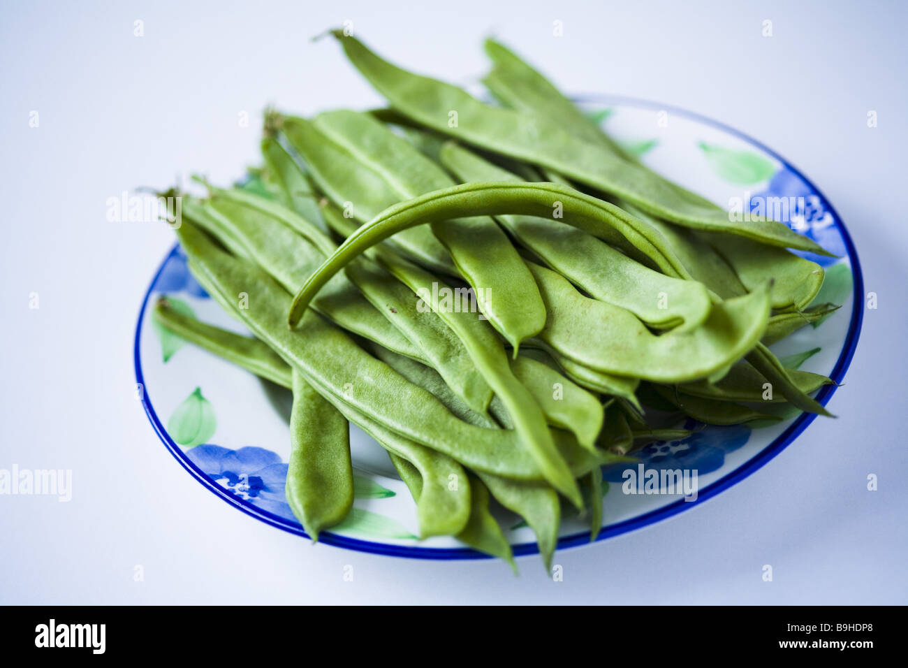 Plates beans green Stock Photo - Alamy