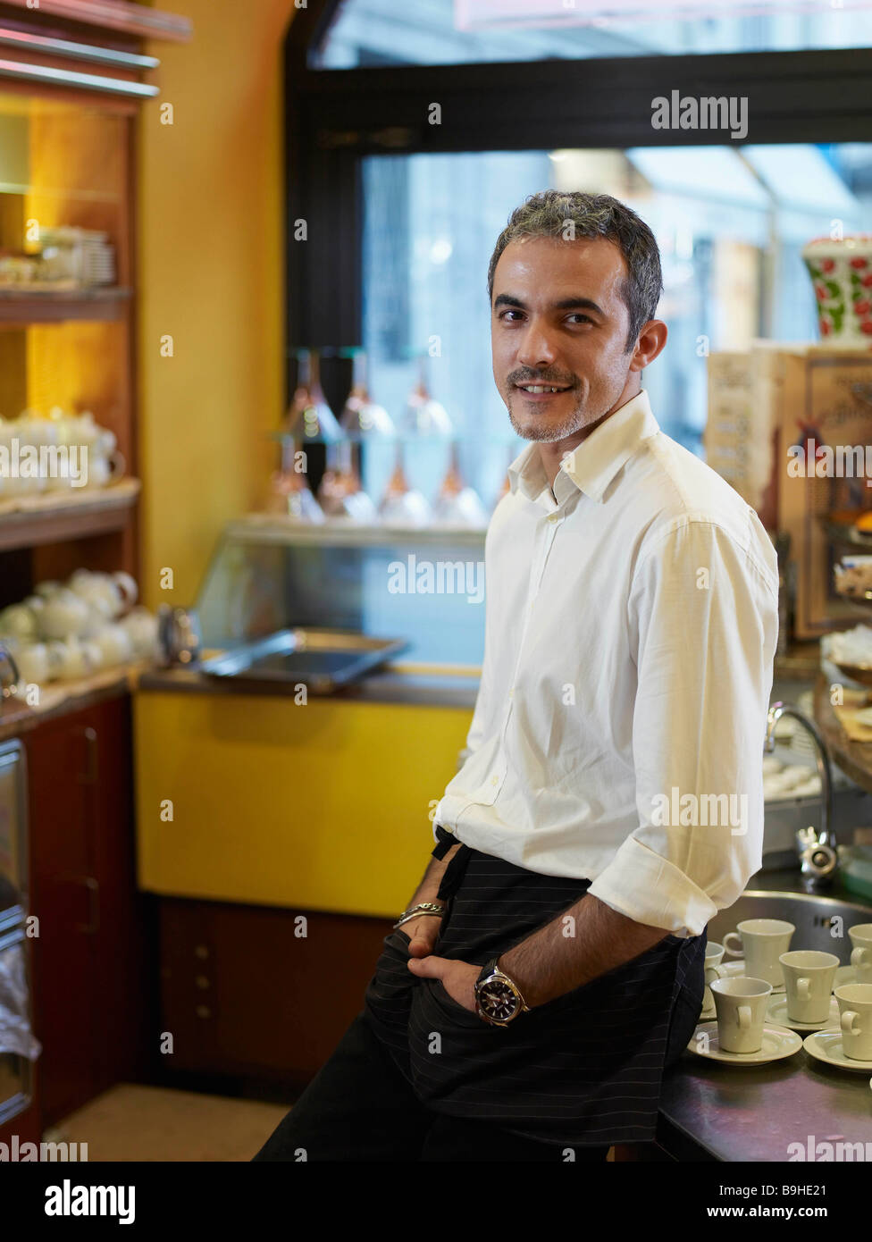 Portrait of waiter in cafe Stock Photo - Alamy