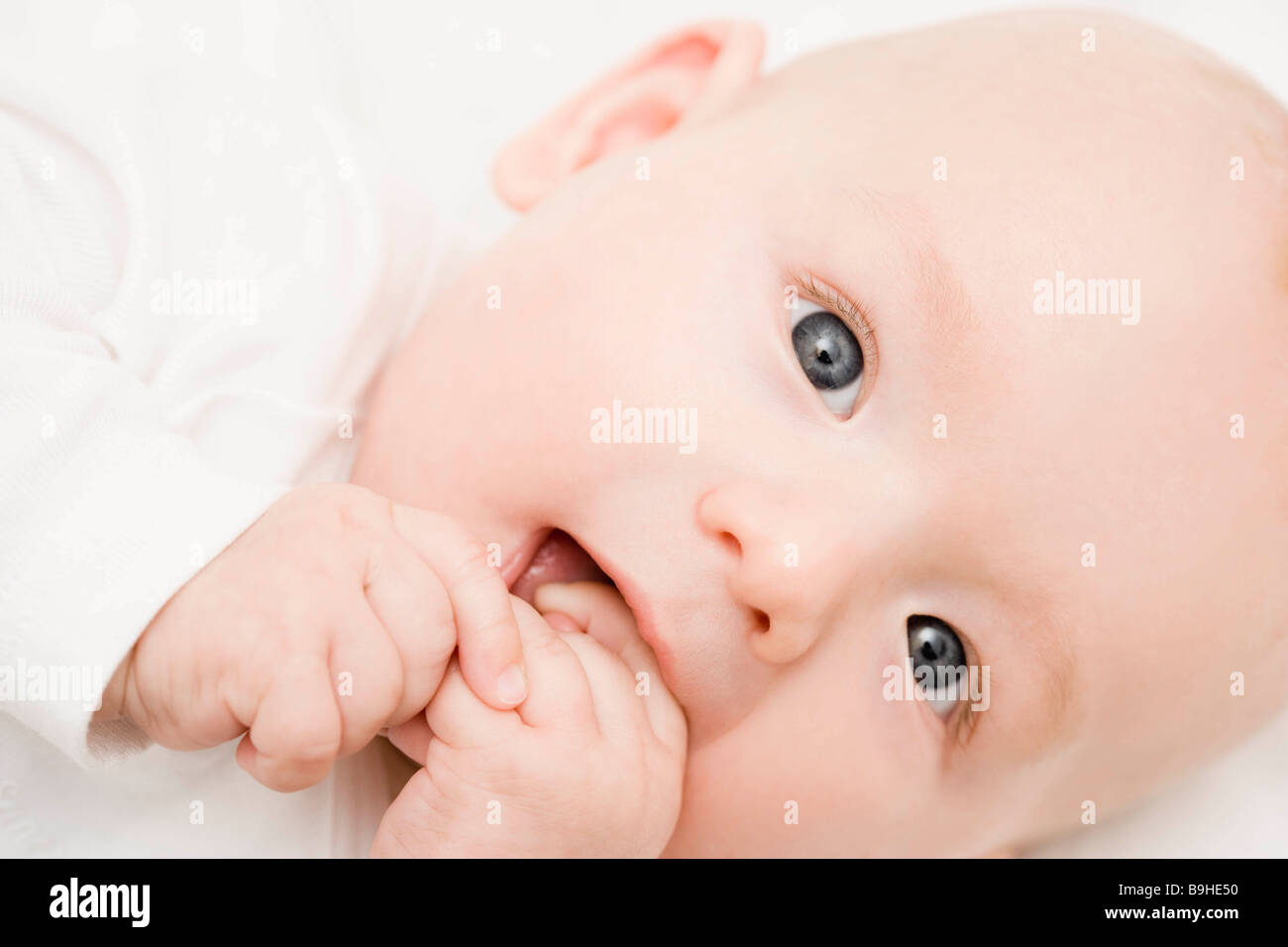 Baby smiling into camera Stock Photo - Alamy