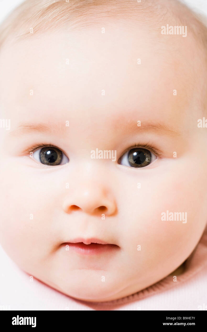 Baby looking to camera close-up Stock Photo - Alamy