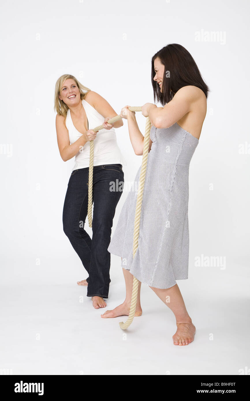 Women friends fun rope-moves series people two 30-40 years blond ...