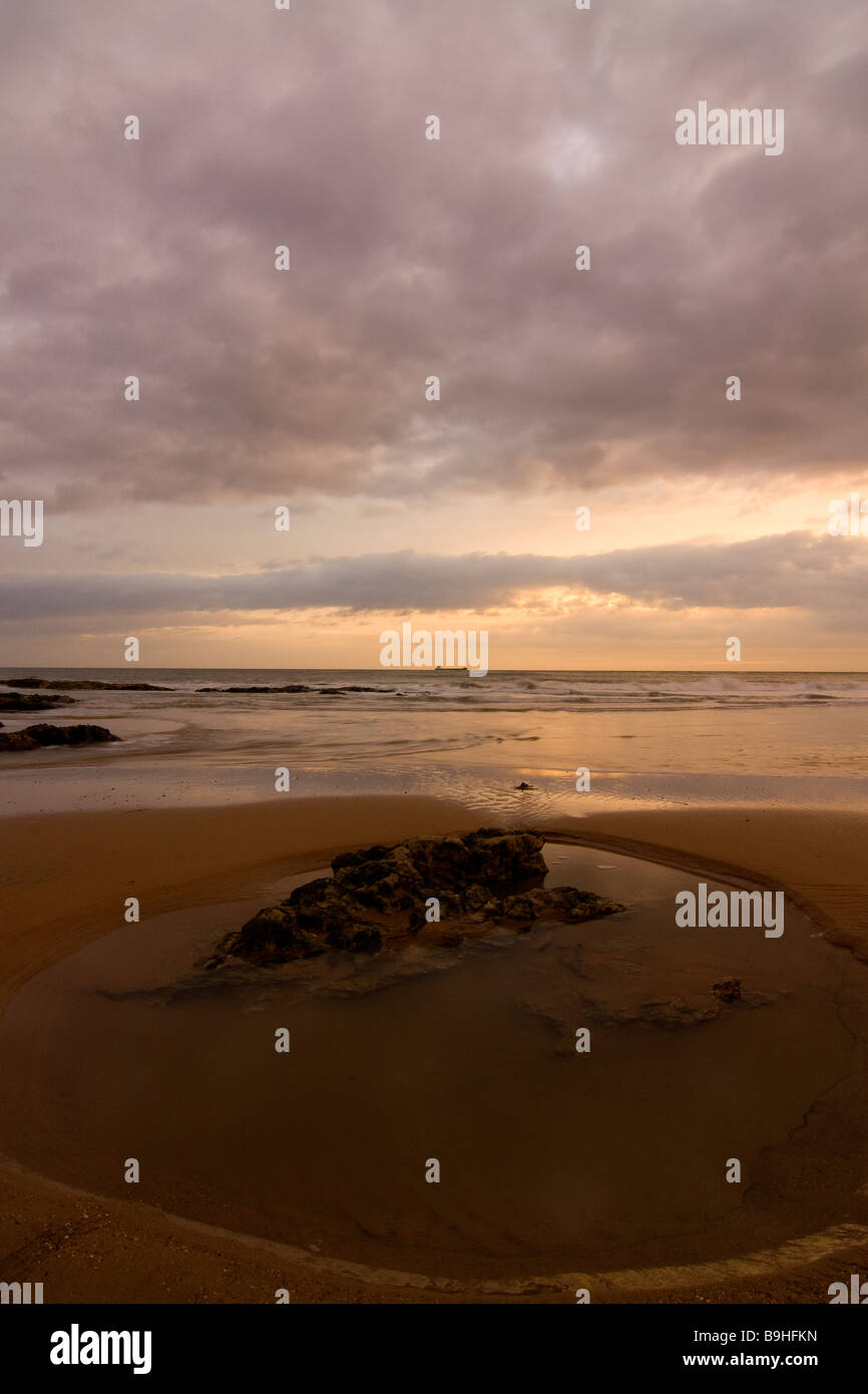Sunrise at Seaham beach overlooking the North Sea with rock pool in ...