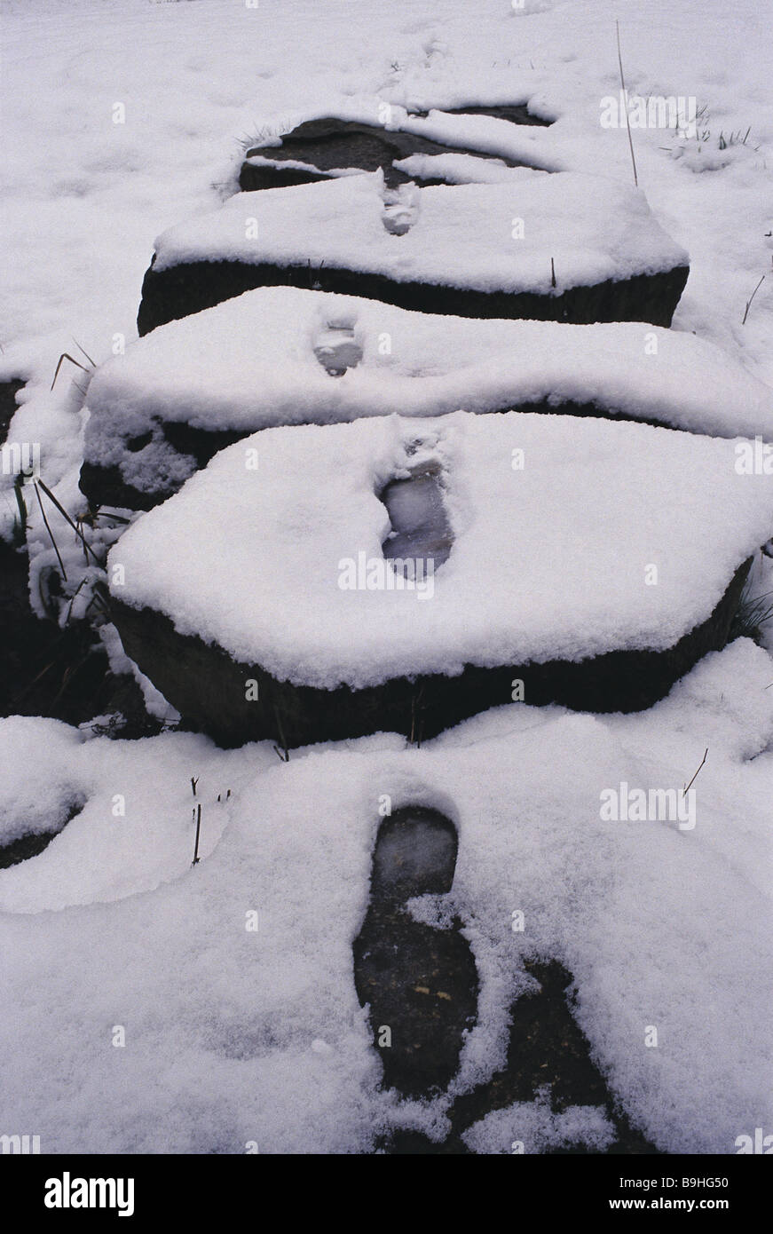 Flagstones snow footprints winter garden step-plates tracks steps shoe ...