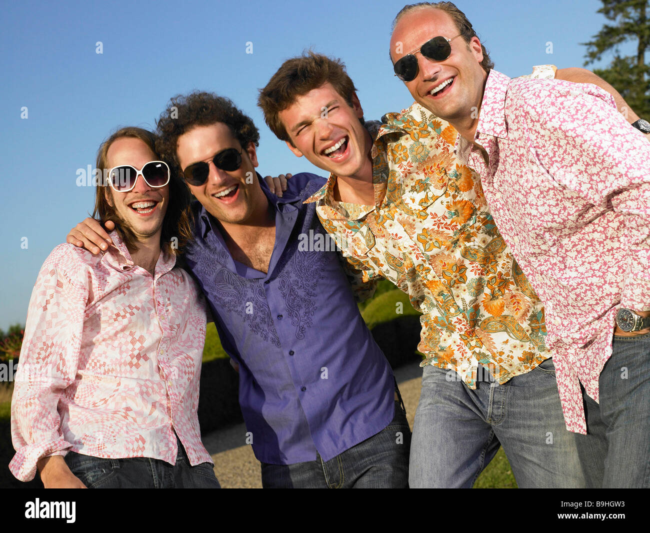 Men smiling at camera Stock Photo - Alamy