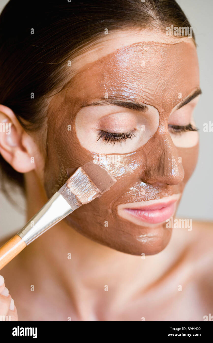 Putting mud on face hi-res stock photography and images - Alamy
