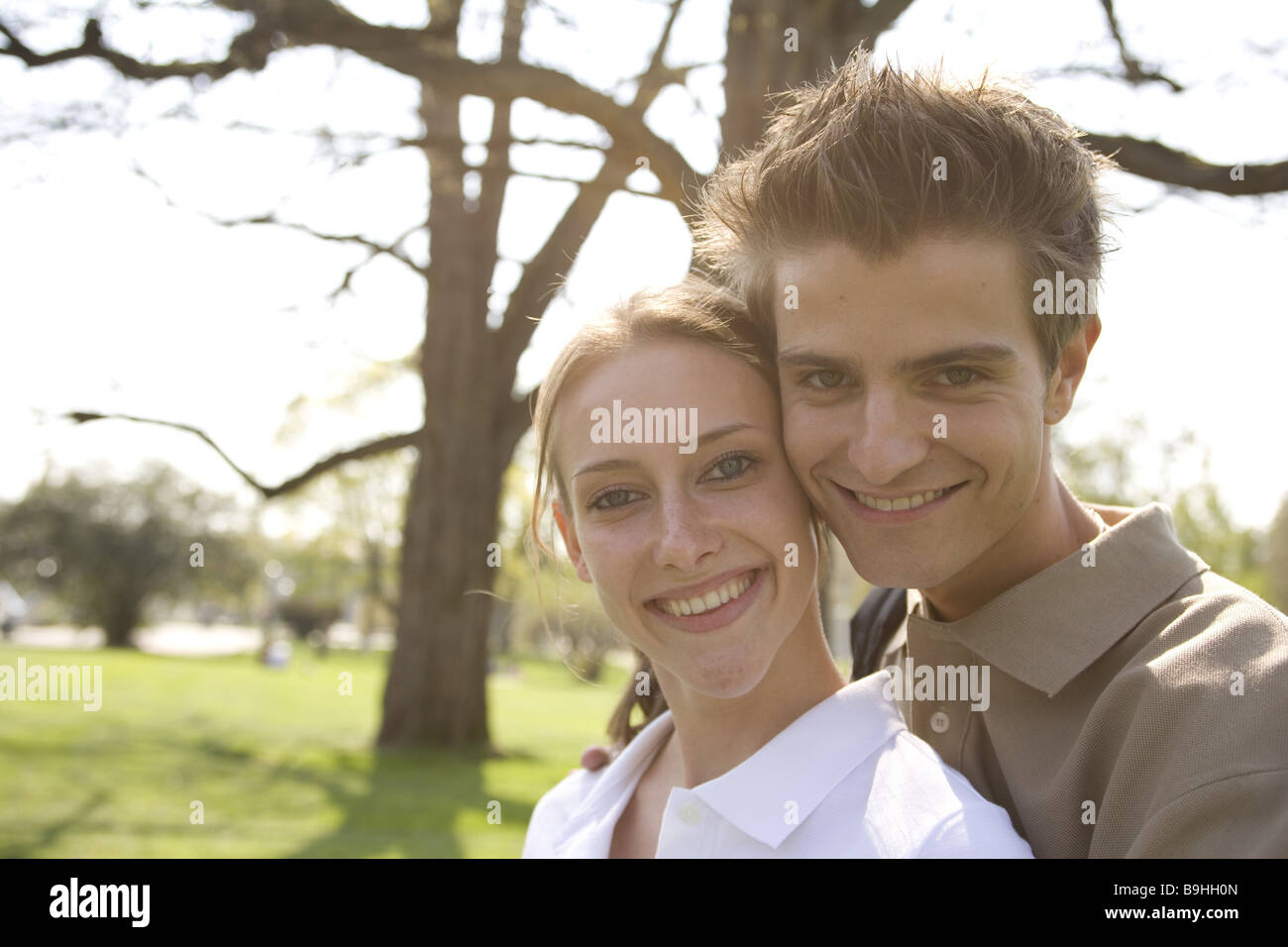 Park couple young fallen in love smiling portrait back light series ...