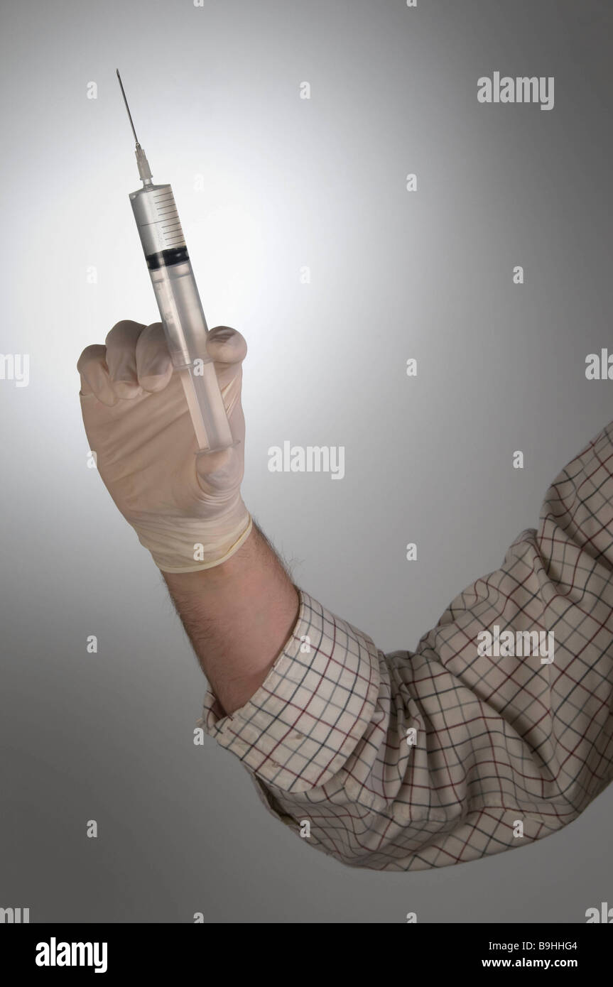 Male holding syringe Stock Photo - Alamy