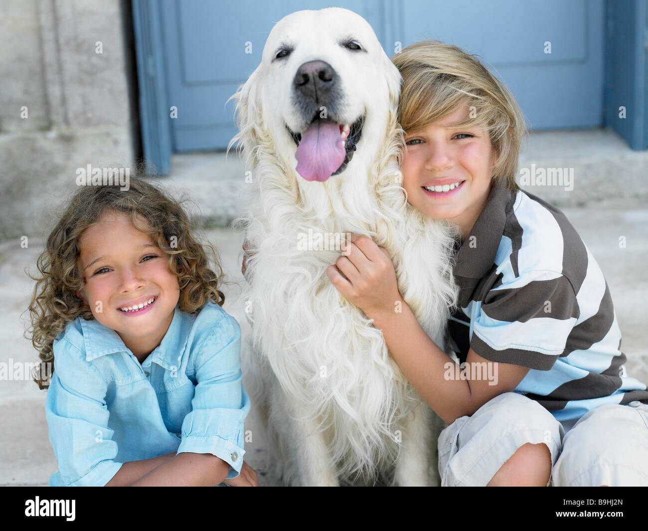 Brother and sister with their dog Stock Photo - Alamy