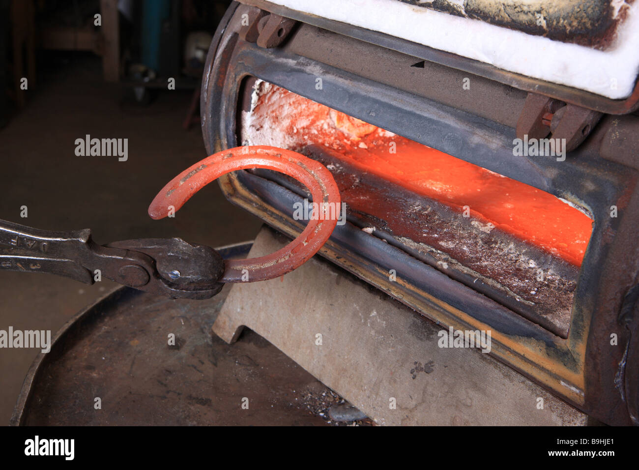 Farrier making horseshoes in his forge Stock Photo - Alamy