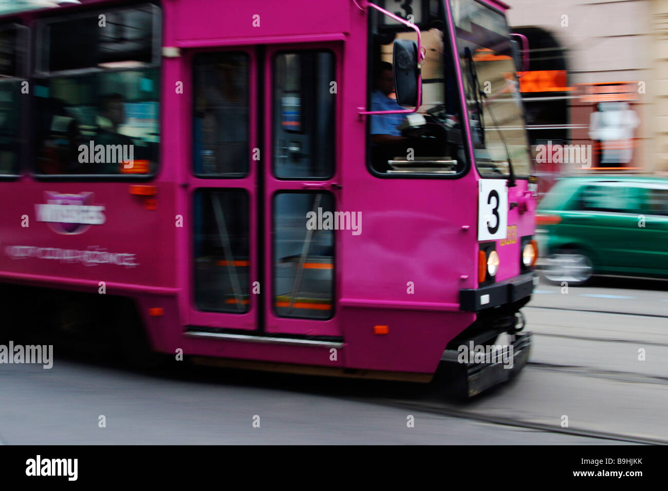 cracow tram blurred motion passes through street Poland Stock Photo - Alamy