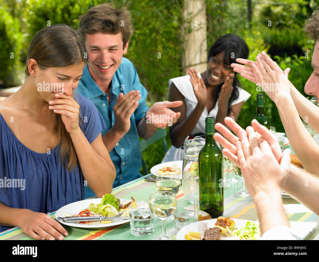 Friends having lunch in the garden Stock Photo - Alamy