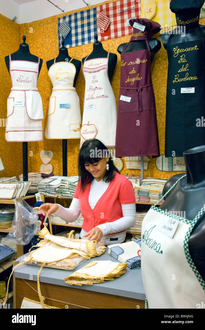 Girls in an apron shop in Venice Italy Stock Photo - Alamy