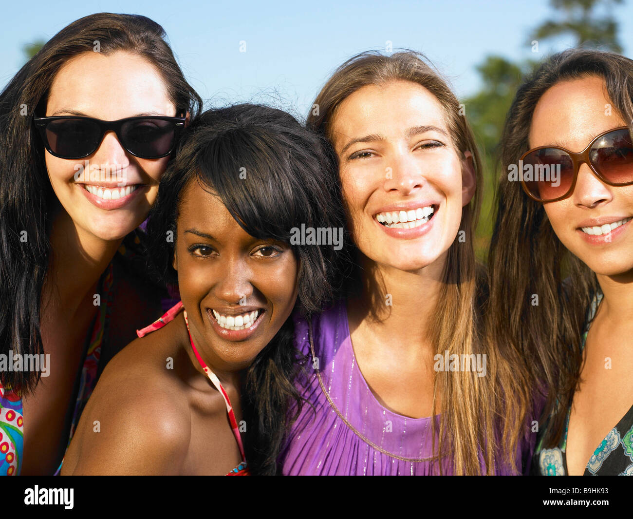 Women smiling at camera Stock Photo - Alamy