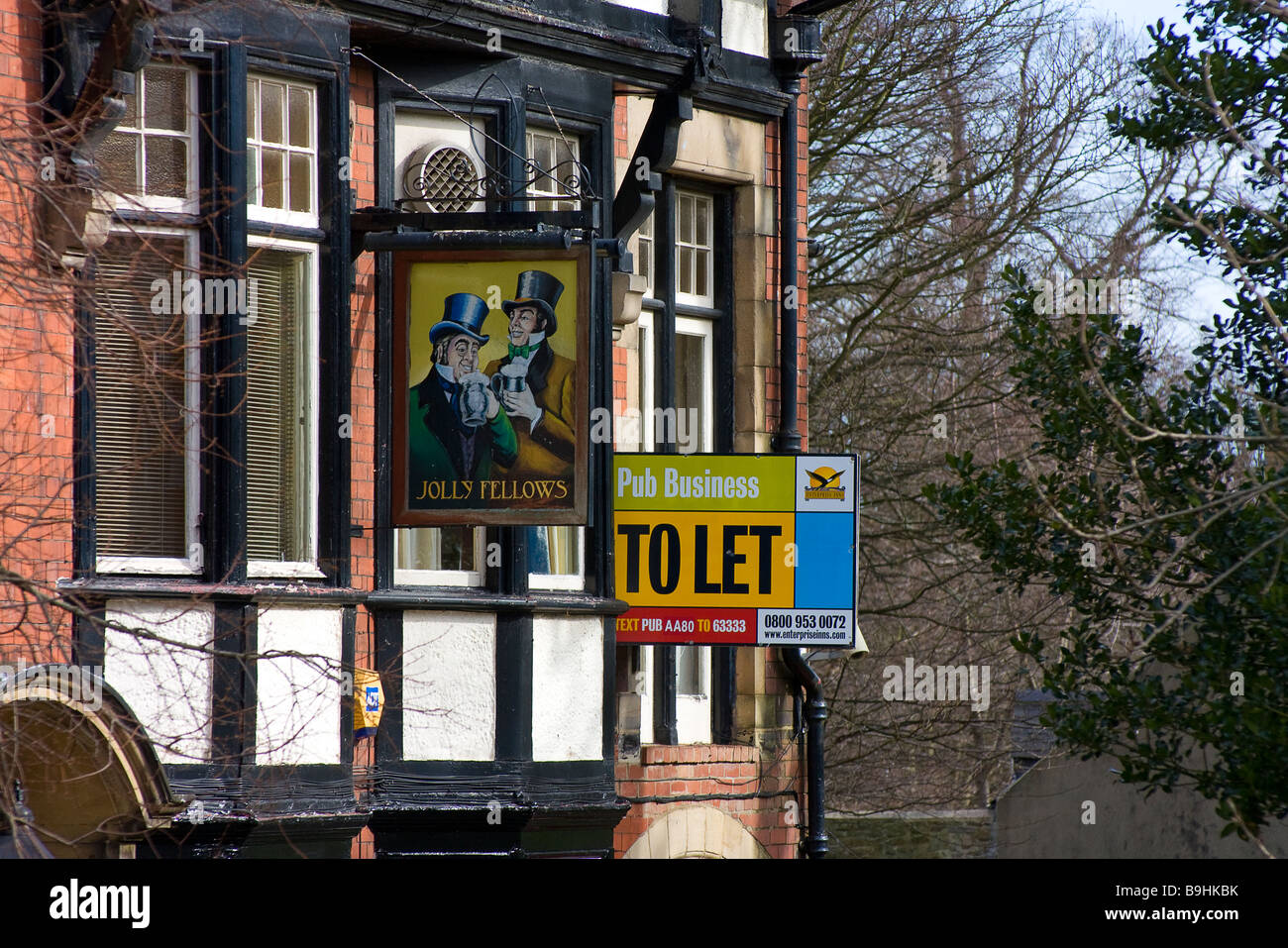 View of old English country pub sign with a To Let sign next to it to ...