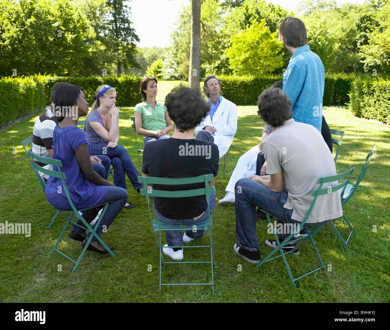 Circle of people in rehab, outdoors Stock Photo - Alamy