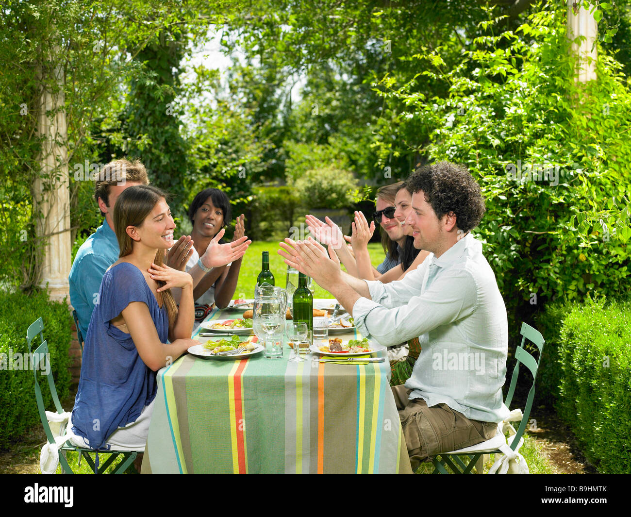 Friends having lunch in the garden Stock Photo - Alamy
